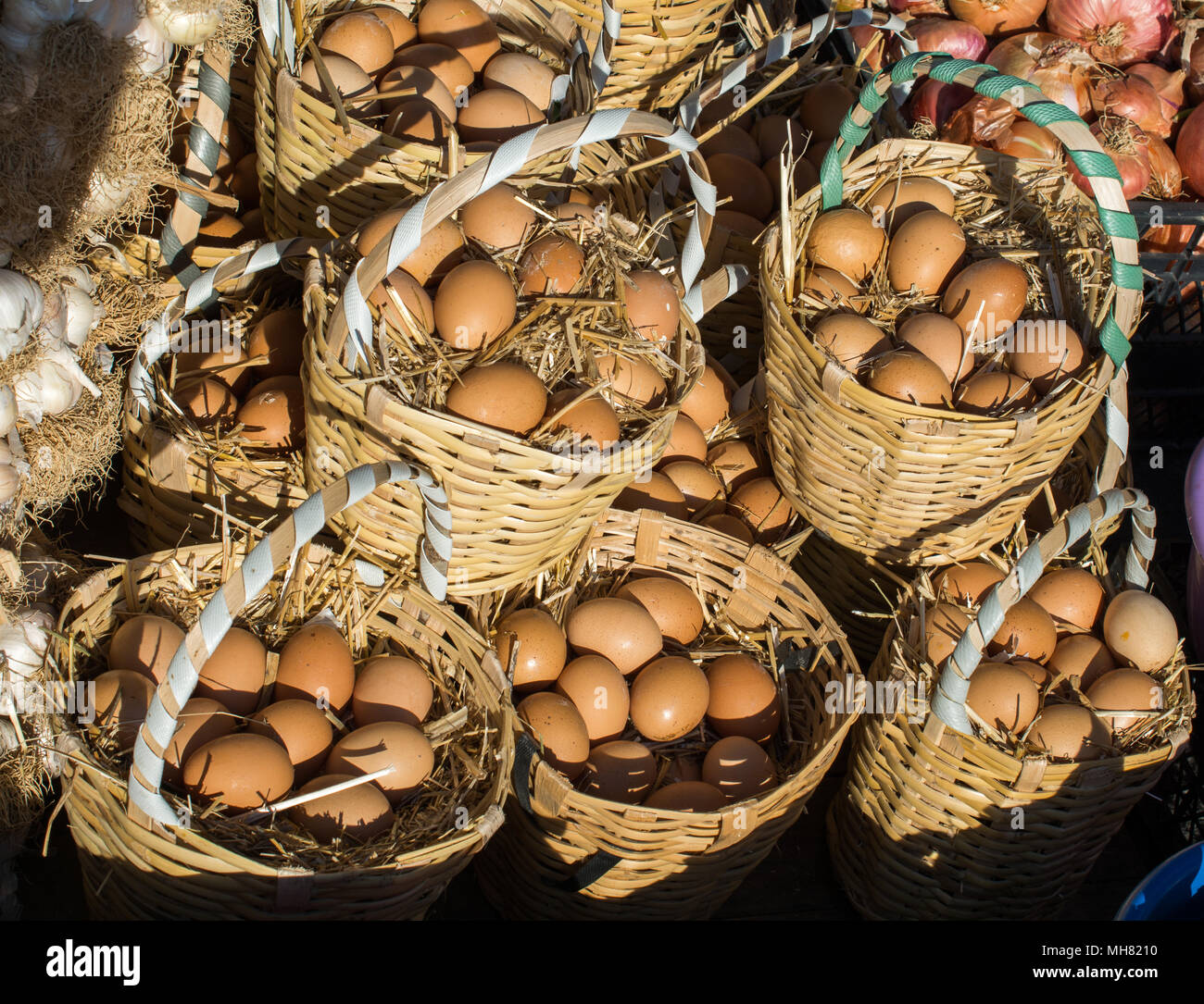 Organic fresh farm eggs in the straw basket Stock Photo - Alamy