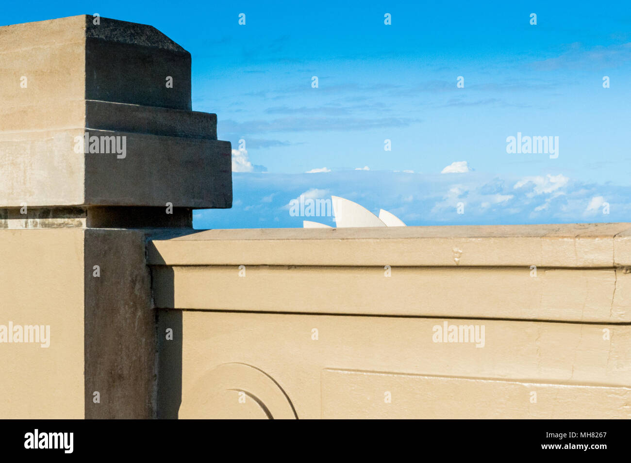 Standing on the stairs leading up to the Sydney Harbour Bridge, the ...