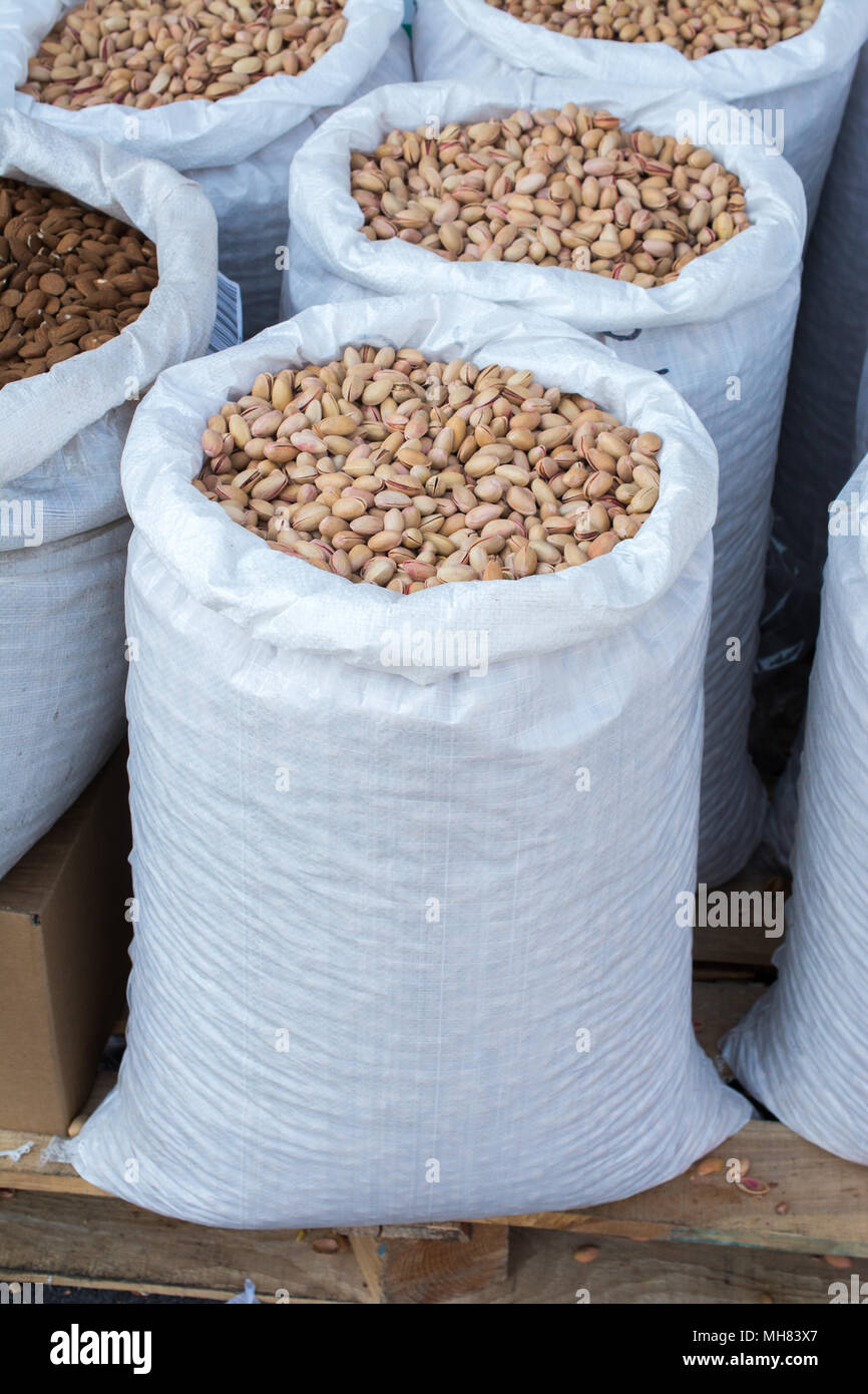 Pistachio nuts with shell ready to eat in sacks Stock Photo - Alamy