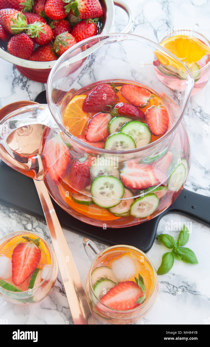 Homemade fruit punch with strawberry, orange and cucumber Stock Photo ...