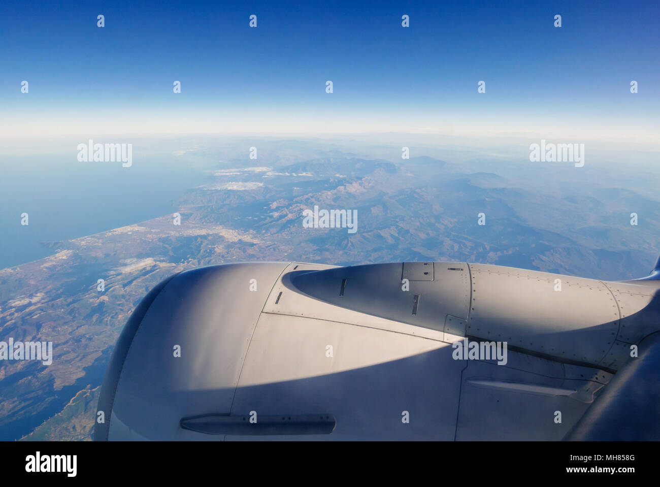 View from plane window on engine and land Stock Photo - Alamy