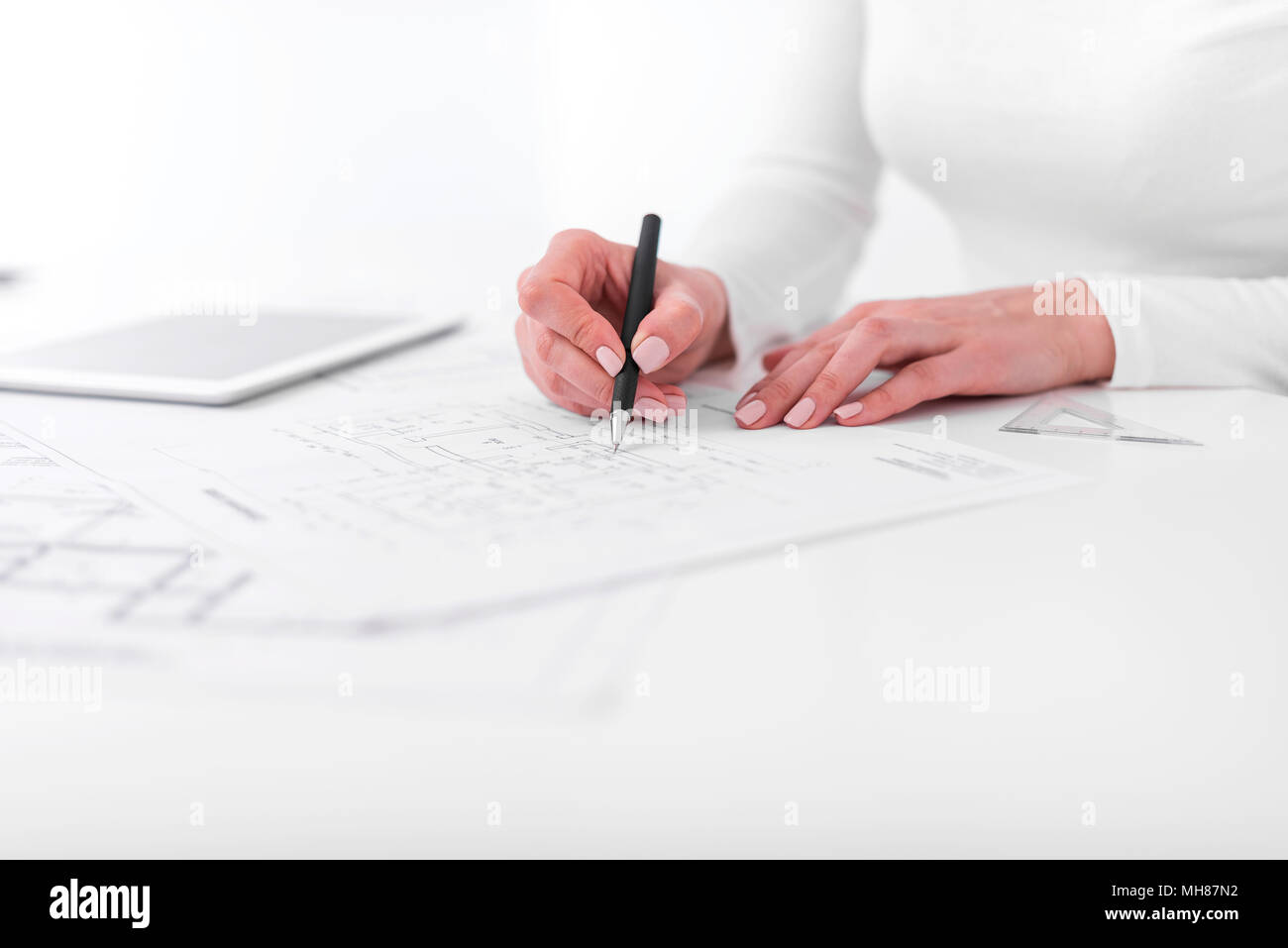 Engineer works with drawings Stock Photo - Alamy