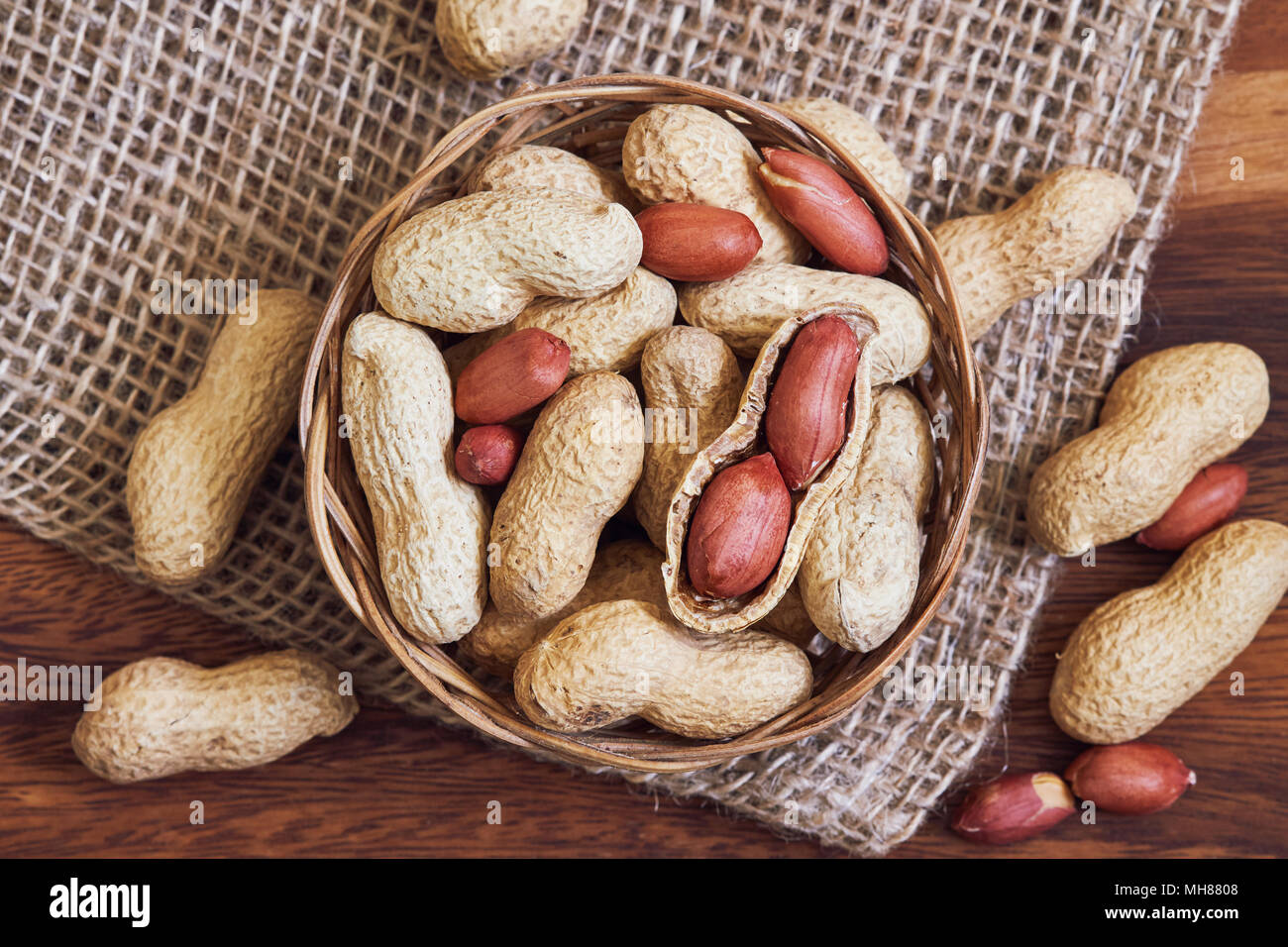 Dry roasted peanuts (salted, in shell) in bowl. Top view Stock Photo ...