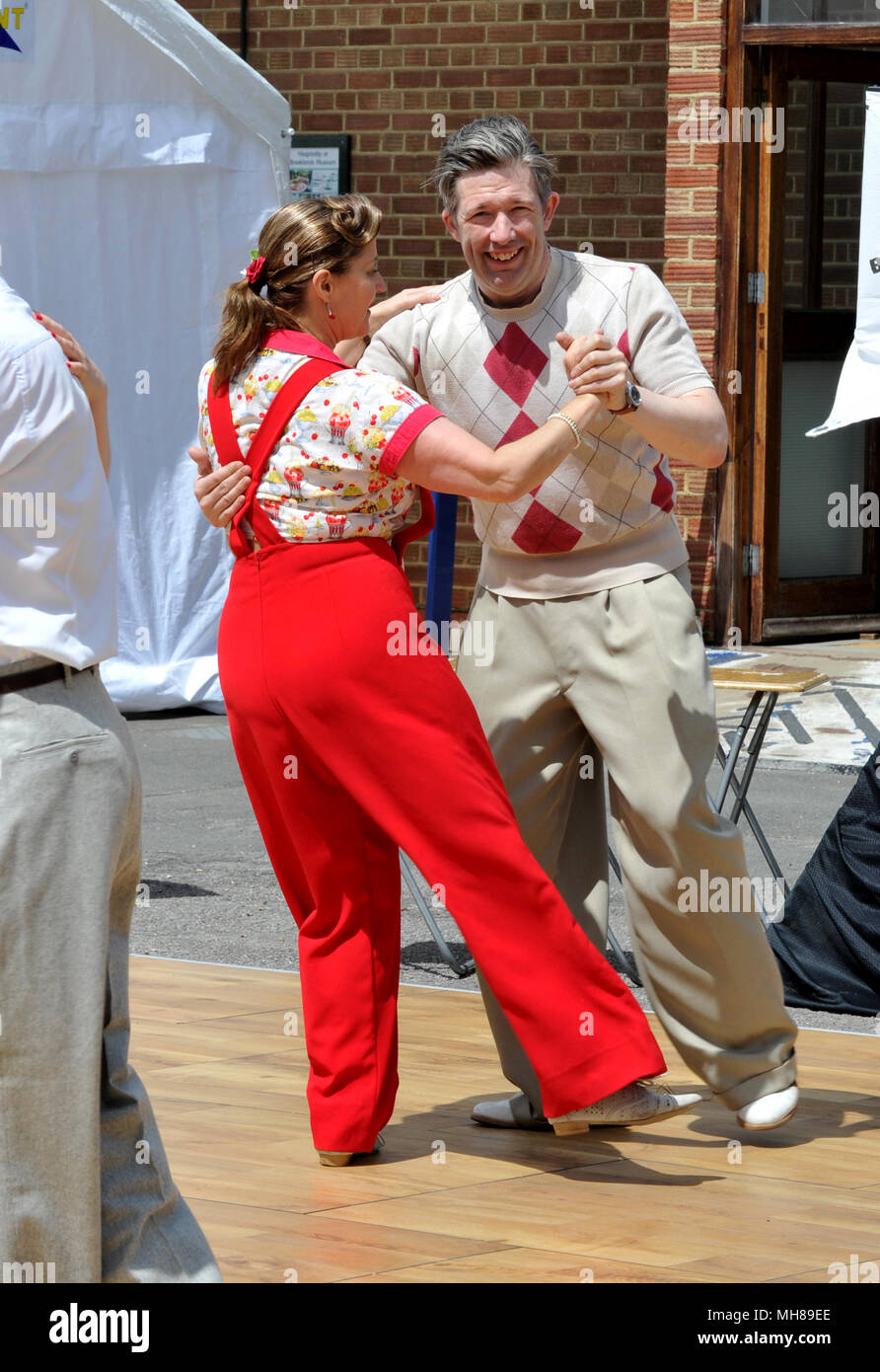 Couple in vintage outfits old time dancing at the Brooklands Double ...