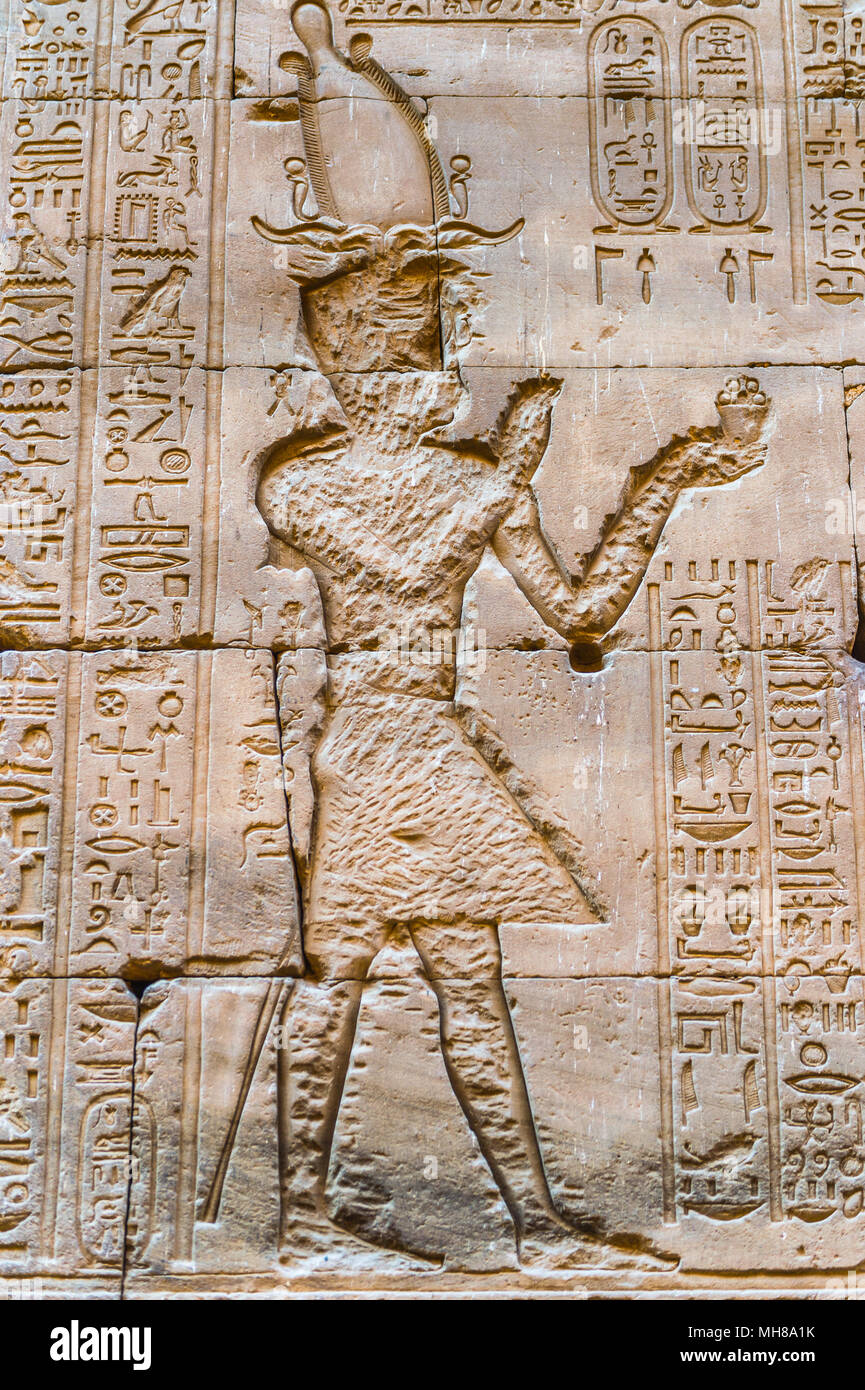Authentic Hieroglyphic illustration of the Egyptian god on the wall in ...