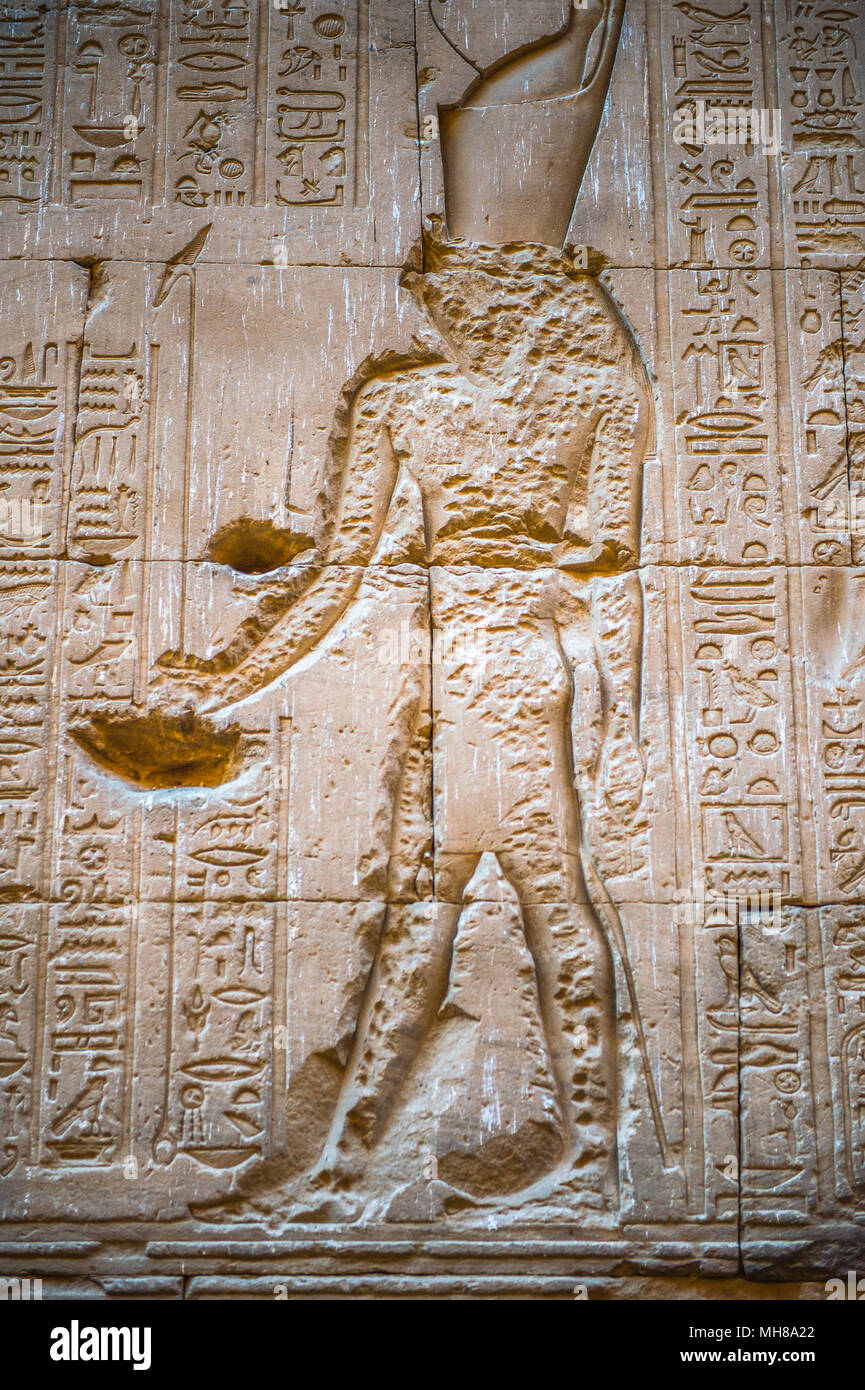 Authentic Hieroglyphic illustration of the Egyptian god on the wall in ...