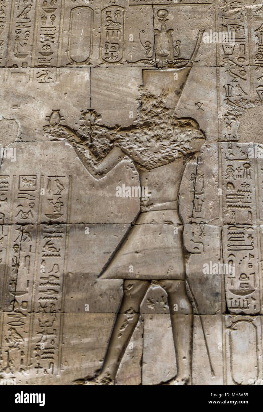 Authentic Hieroglyphic illustration of the Egyptian god on the wall in ...