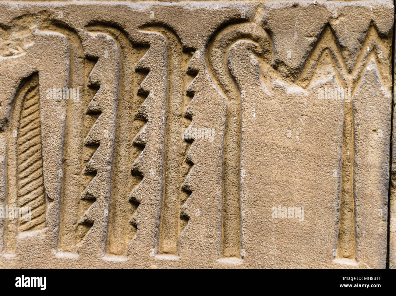 Egyptian hieroglyphs on the wall in a temple Stock Photo - Alamy