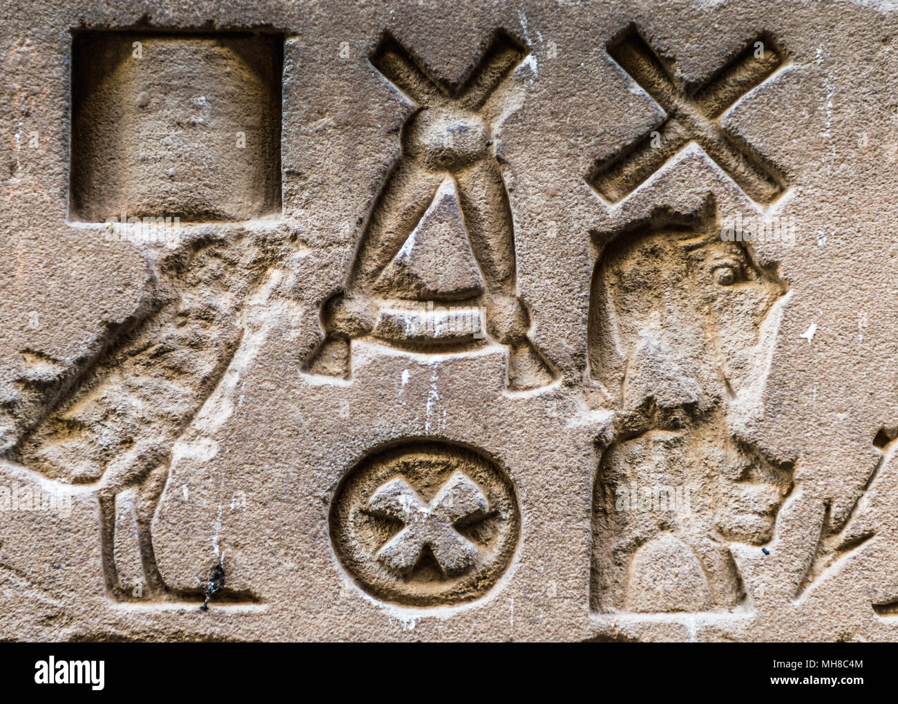 Egyptian hieroglyphs on the wall in a temple Stock Photo - Alamy