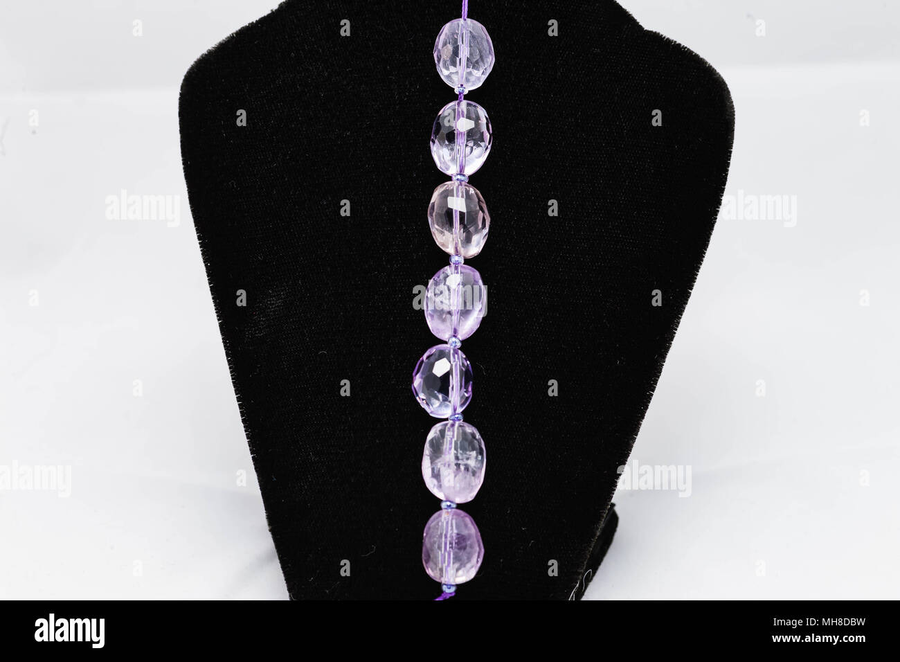 a strand of large oblong faceted purple beads Stock Photo - Alamy