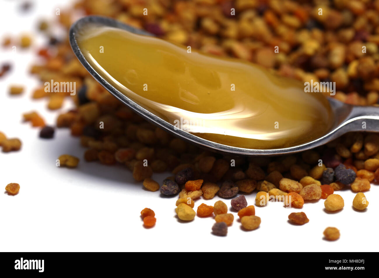 Bee pollen propolis with a spoon Stock Photo - Alamy