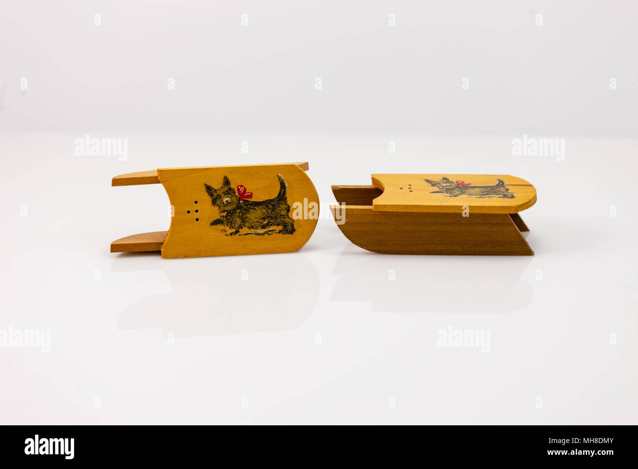 wooden snow sled salt and pepper shaker set Stock Photo - Alamy