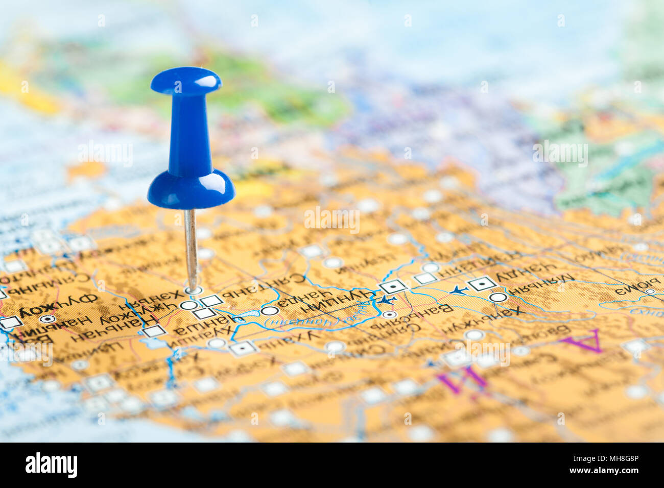 Travel destination, blue pin on the map Stock Photo - Alamy