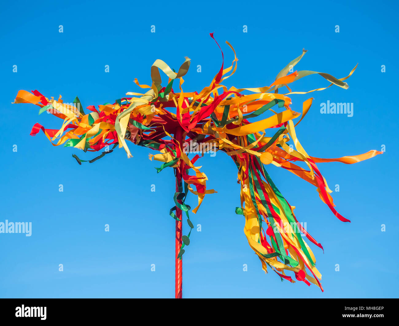 Festive Wooden Pole for Climb on Maslenitsa. Wooden wheel with colorful ...