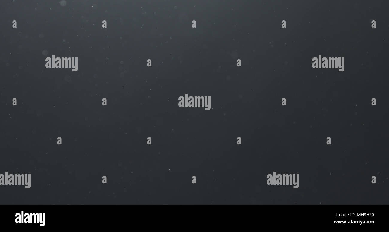 real dust floating in air over dark background Stock Photo - Alamy