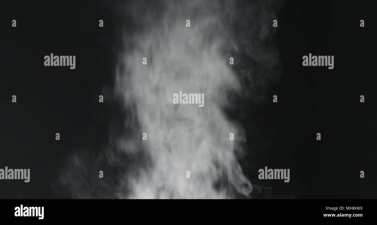 vapor steam rising over black background Stock Photo - Alamy