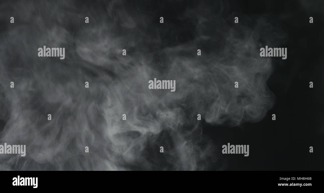 vapor steam rising over black background Stock Photo - Alamy