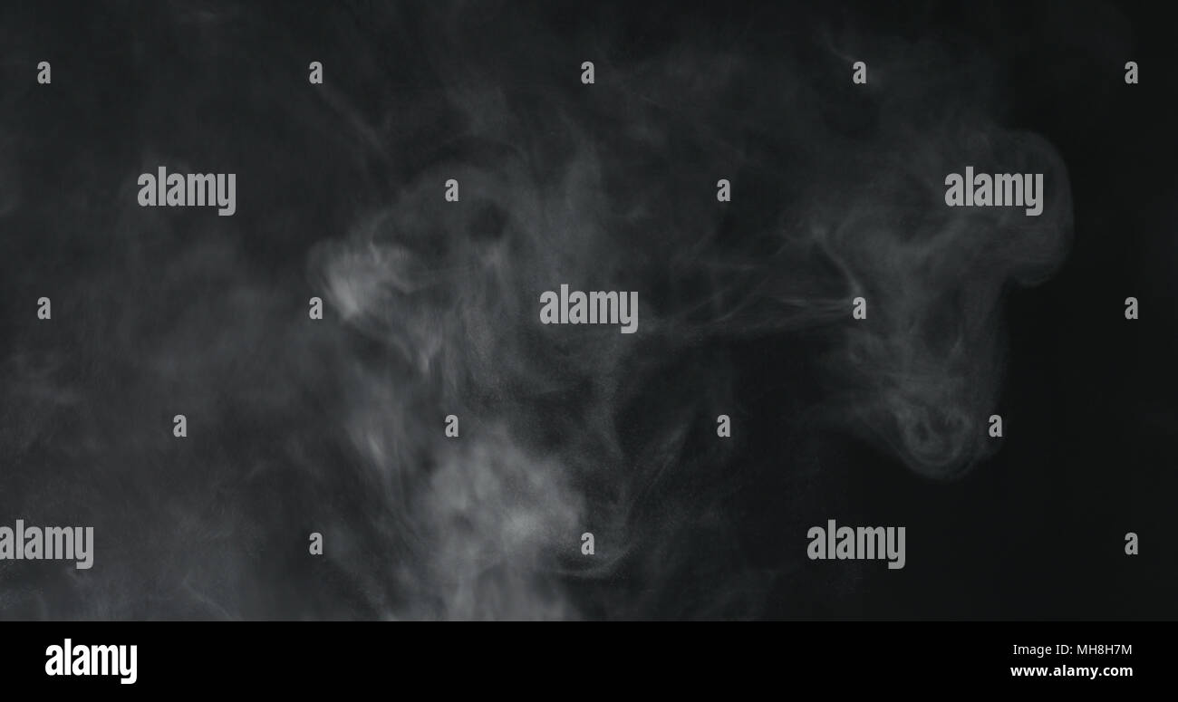vapor steam rising over black background Stock Photo - Alamy