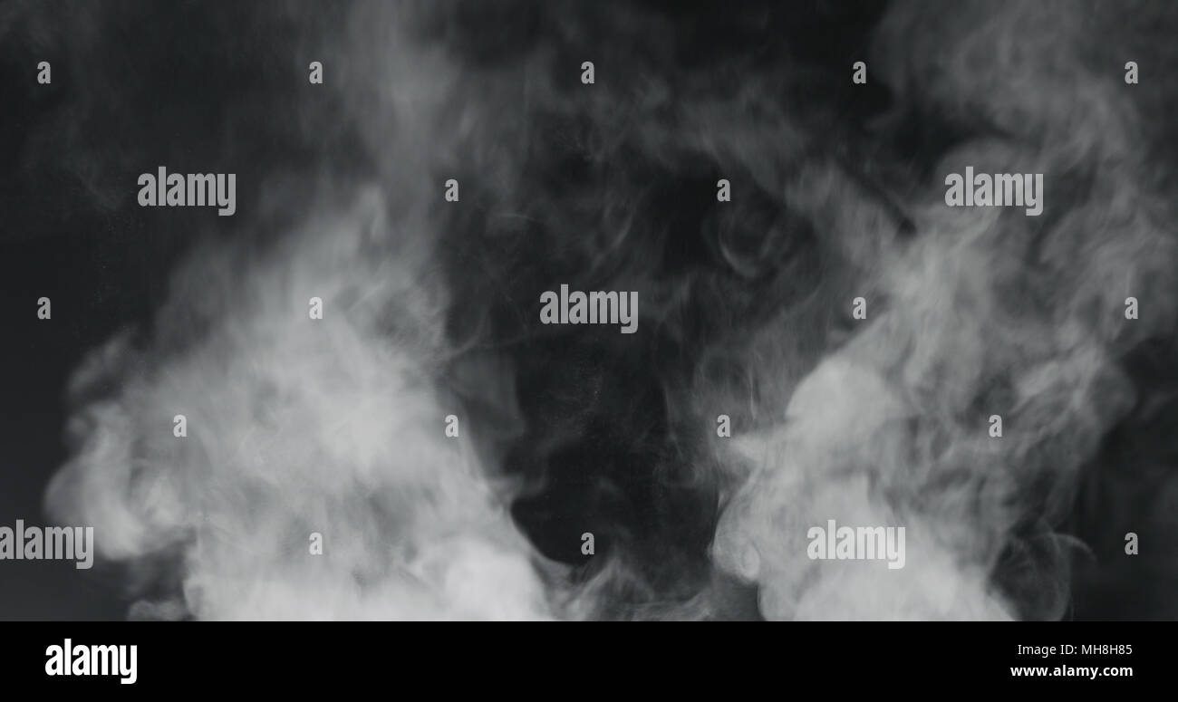 vapor steam rising over black background Stock Photo - Alamy