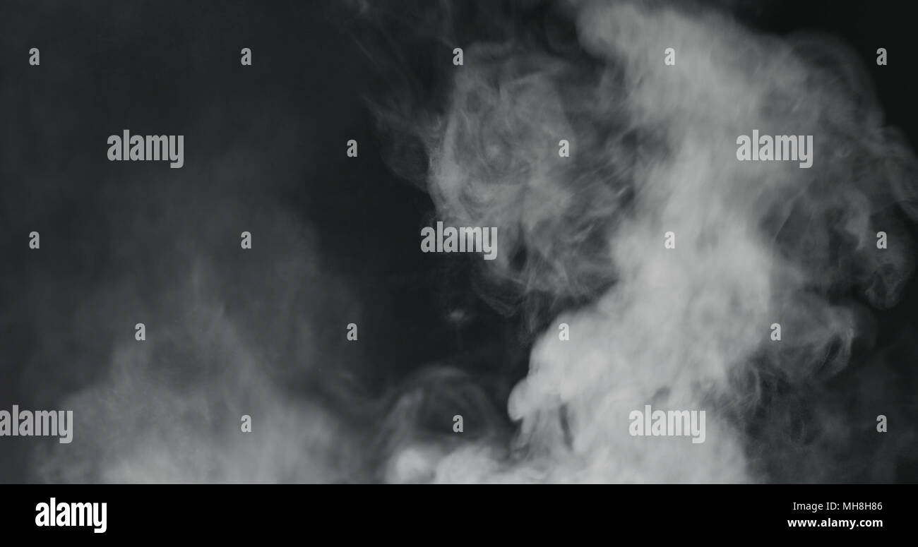 vapor steam rising over black background Stock Photo - Alamy