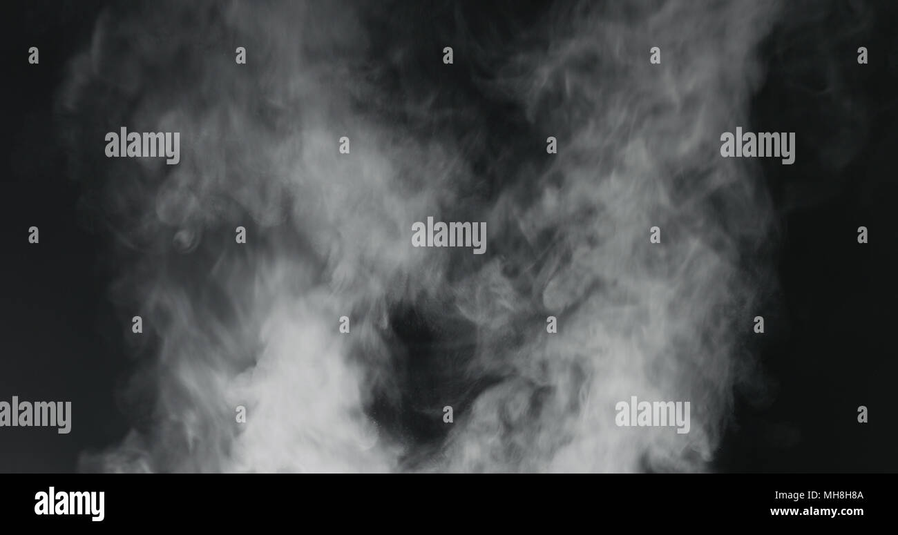vapor steam rising over black background Stock Photo - Alamy