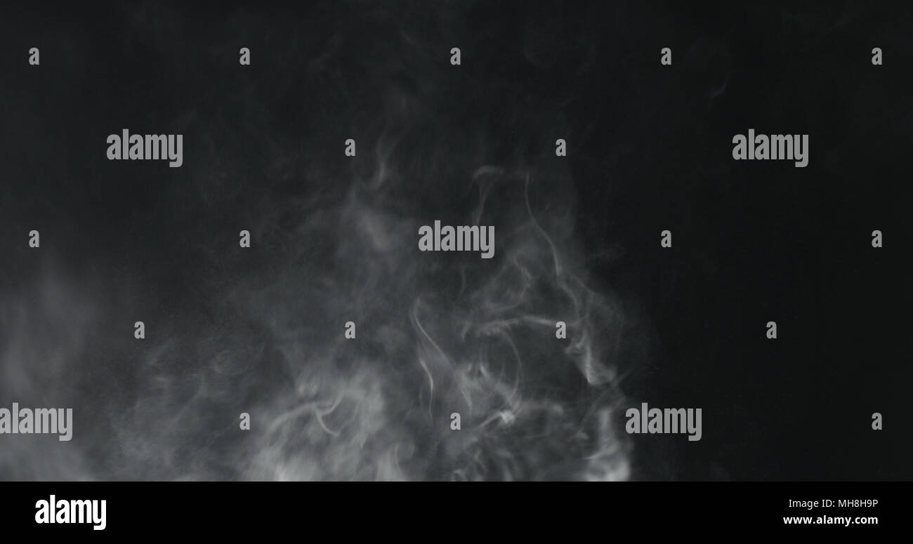 vapor steam rising over black background Stock Photo - Alamy