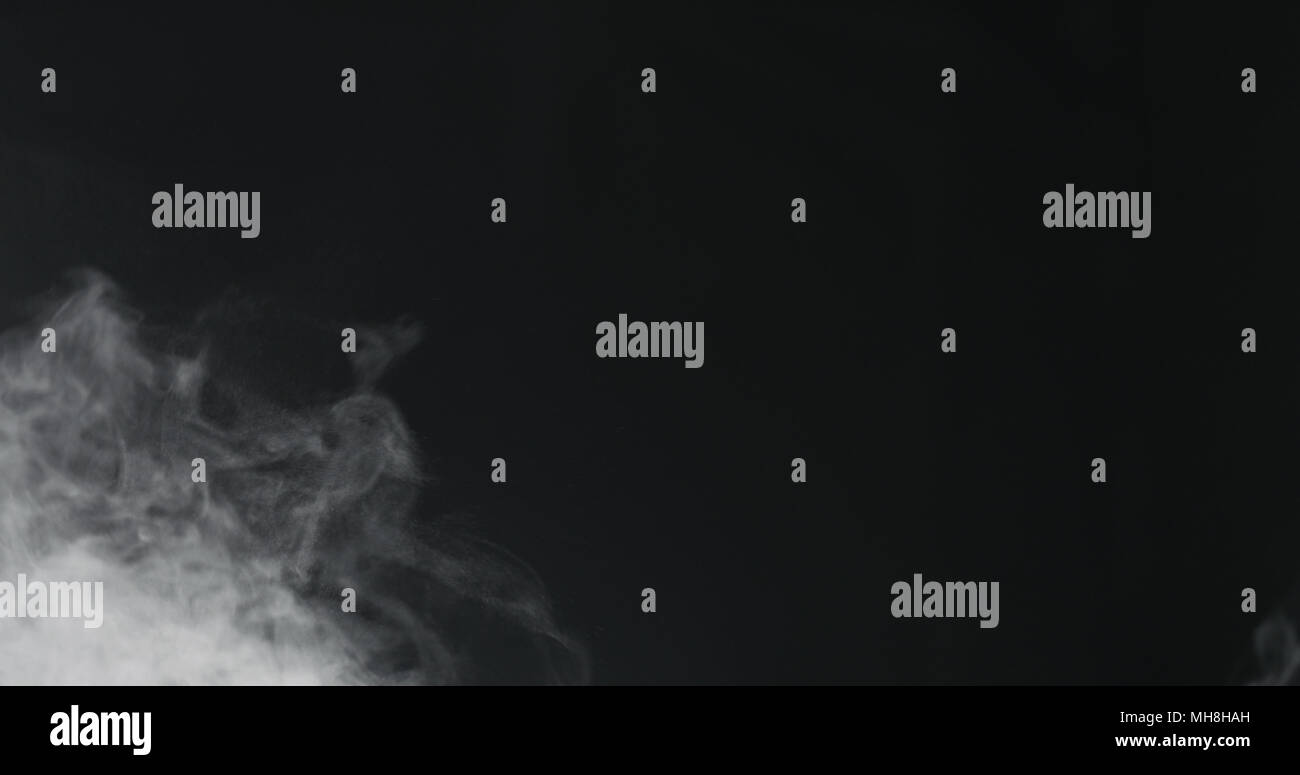 vapor steam rising over black background Stock Photo - Alamy