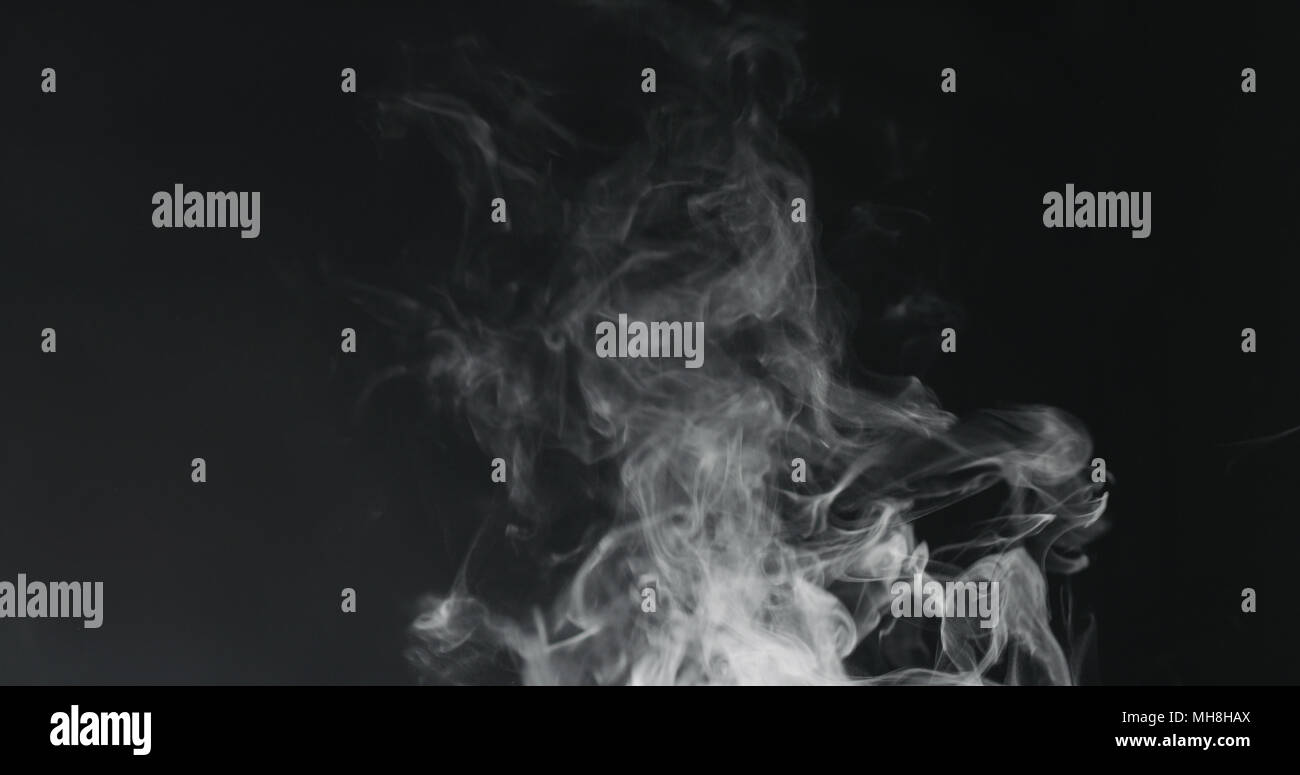 vapor steam rising over black background Stock Photo - Alamy