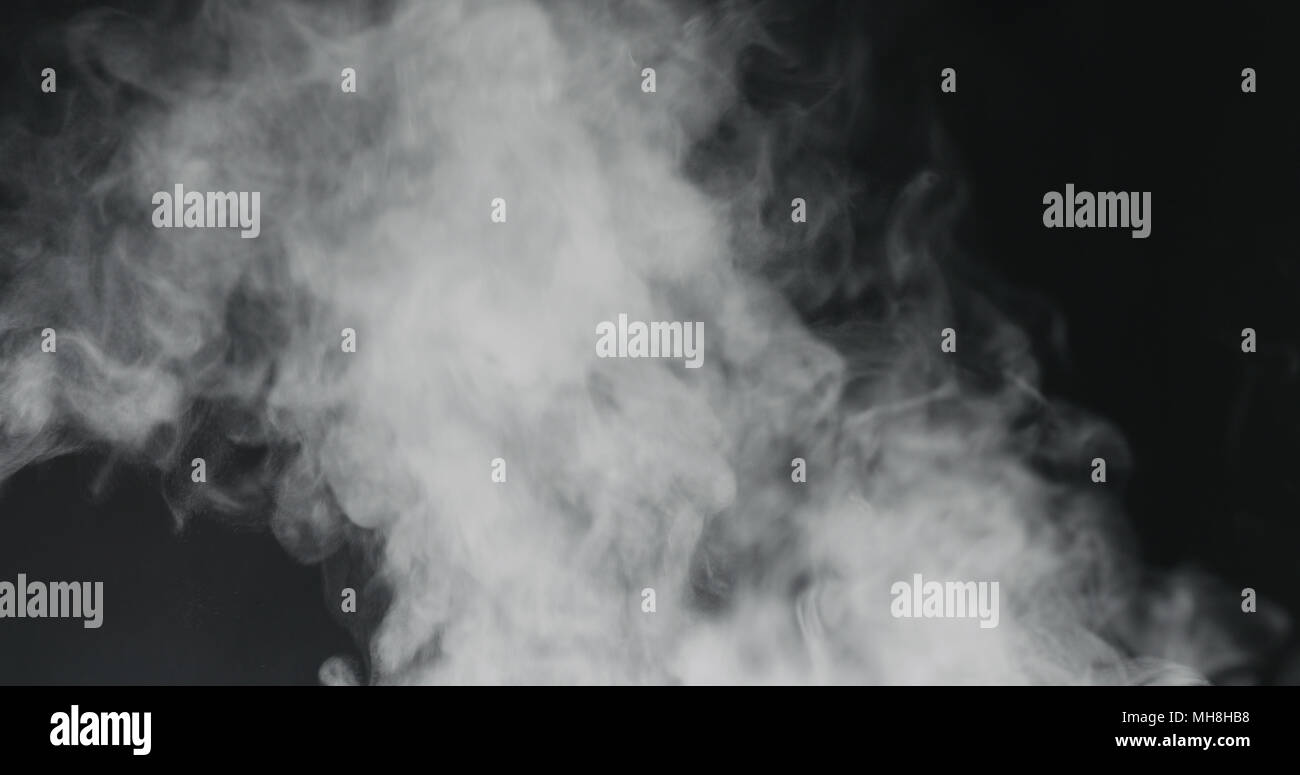 vapor steam rising over black background Stock Photo - Alamy