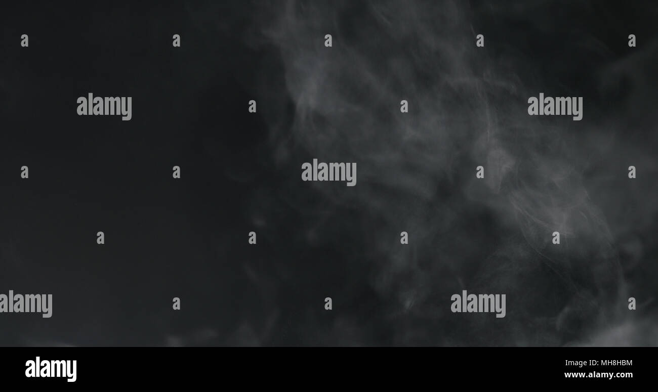 vapor steam rising over black background Stock Photo - Alamy