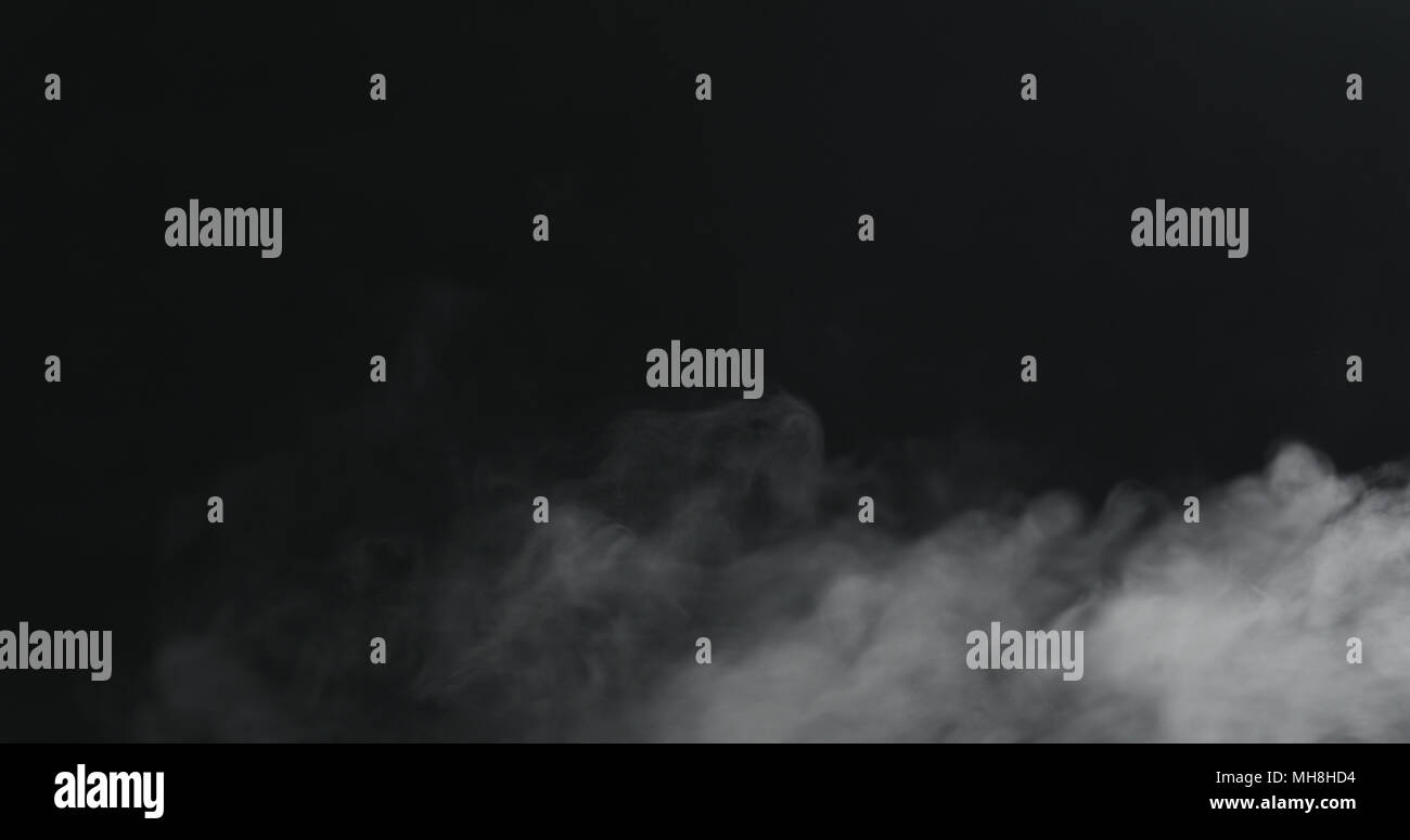 vapor steam rising over black background Stock Photo - Alamy