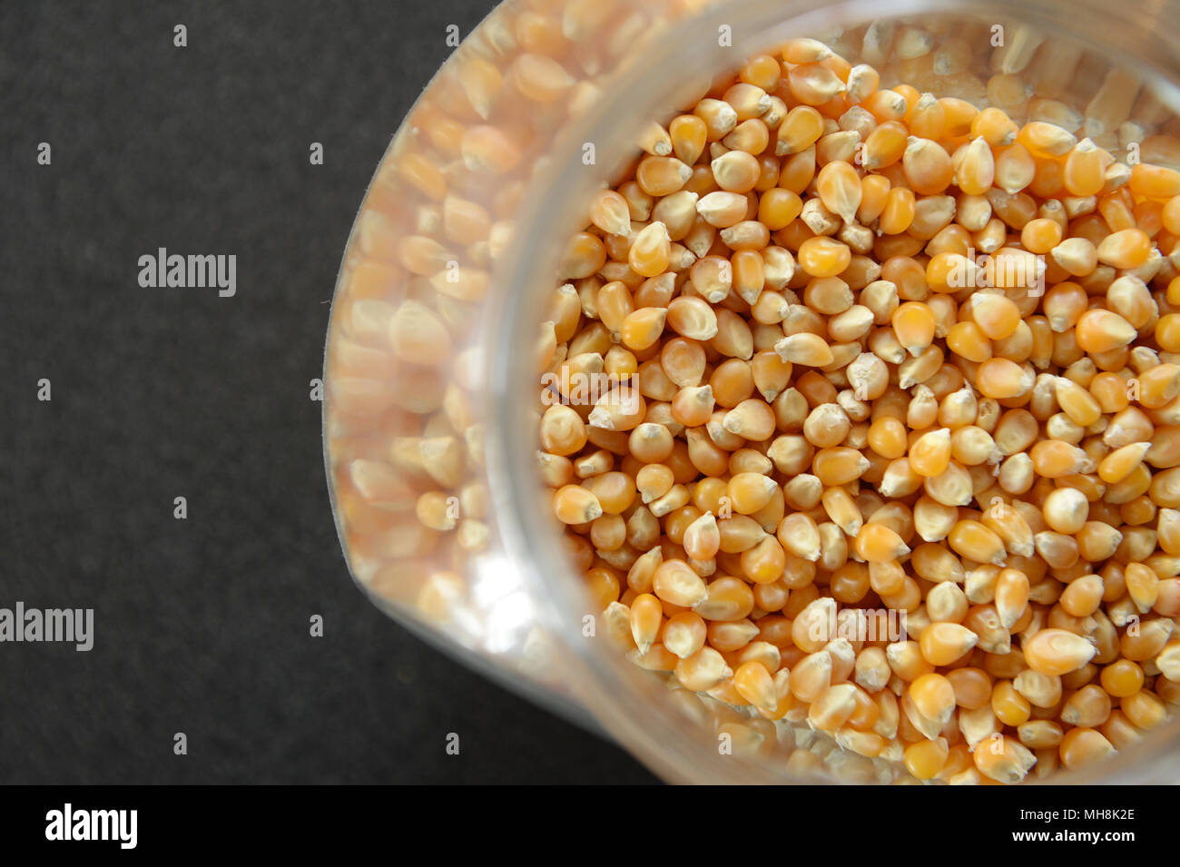 Popcorn grain in a storage jar Stock Photo - Alamy