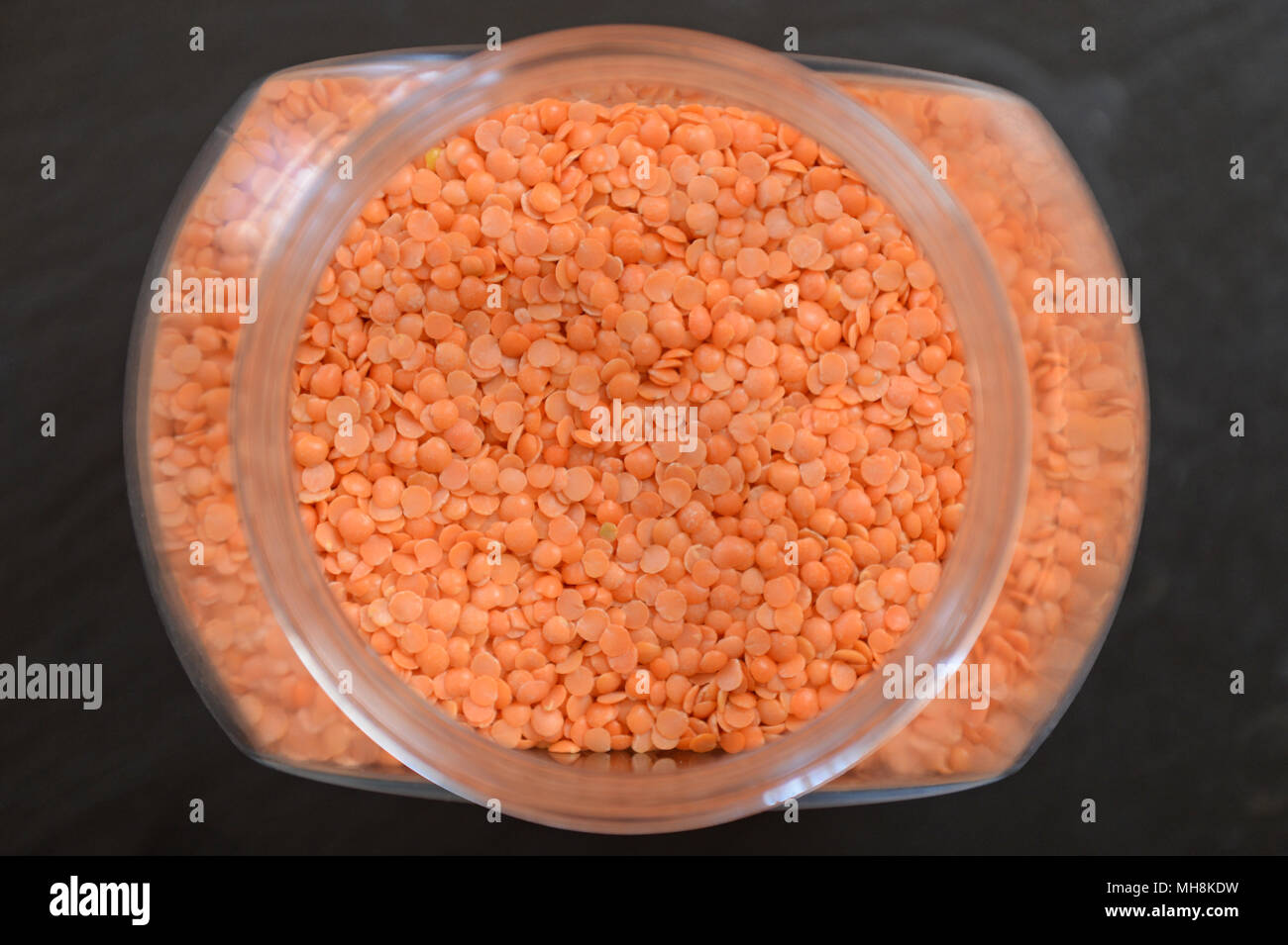 Red lentils in a storage jar Stock Photo - Alamy