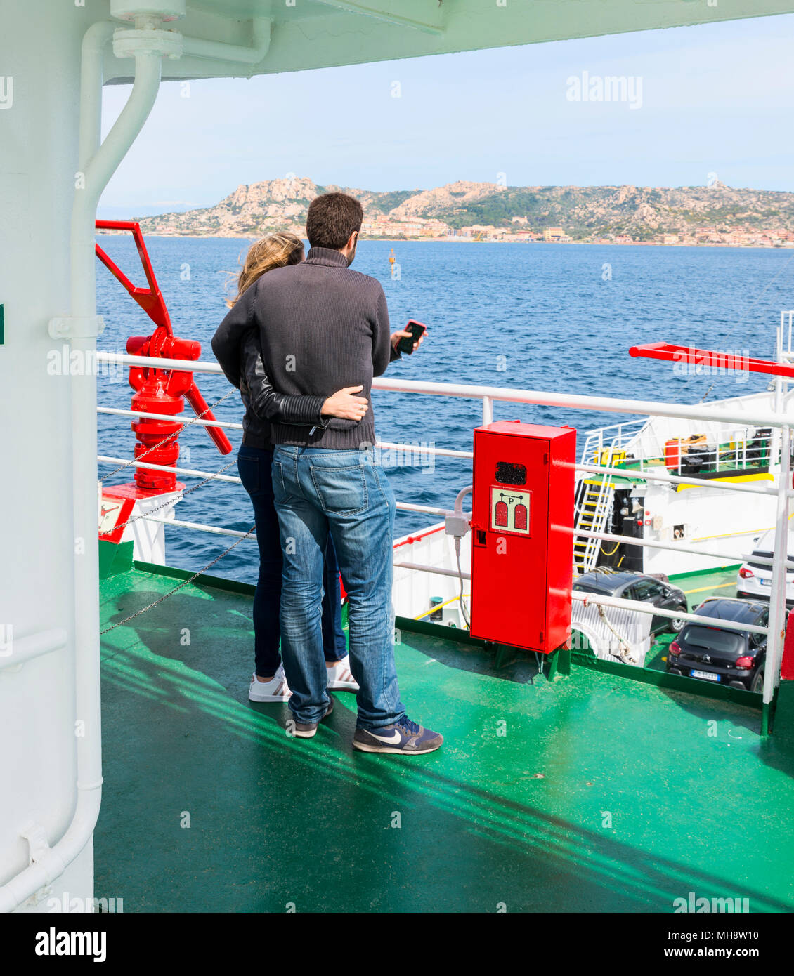 Couple in love on a ferry from palau to the island of maddalena, the ...
