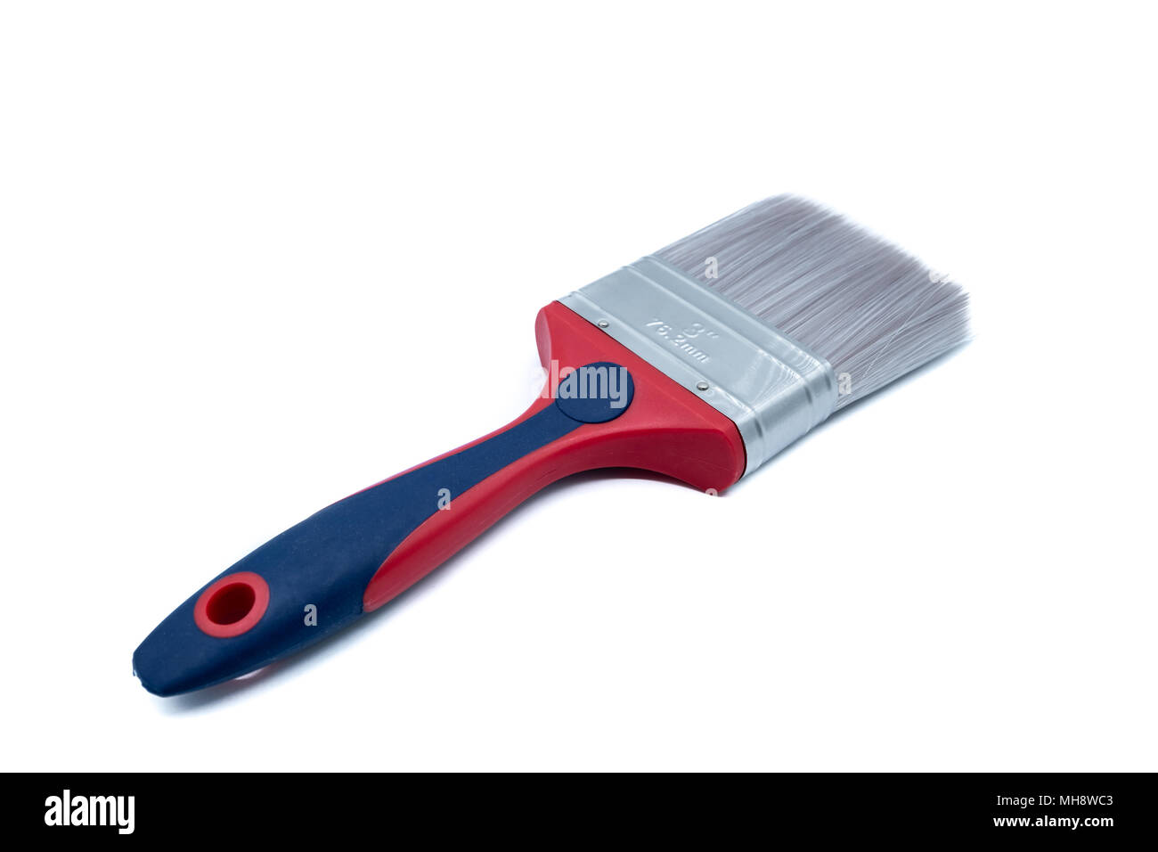 A disposable plastic paintbrush with a red and blue plastic handle ...
