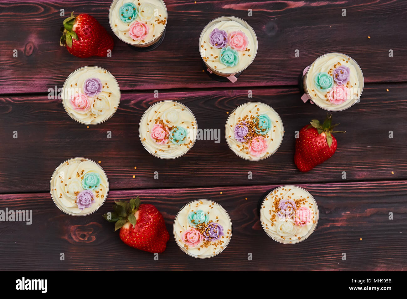 Cake with strawberry served in glass shots, wooden background Stock ...