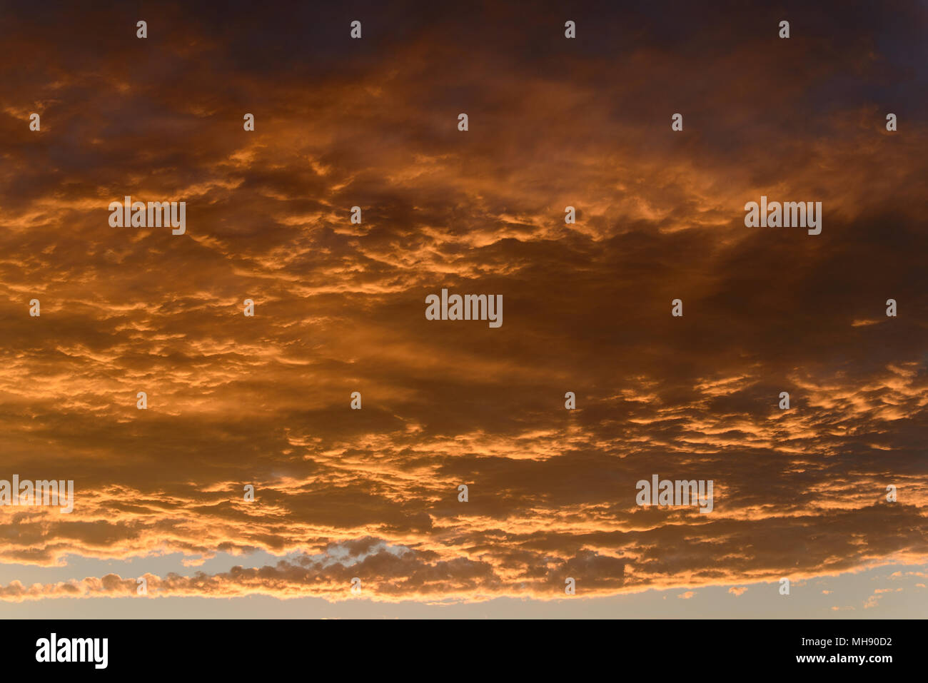 Dramatic sunset clouds, golden and red color Stock Photo - Alamy