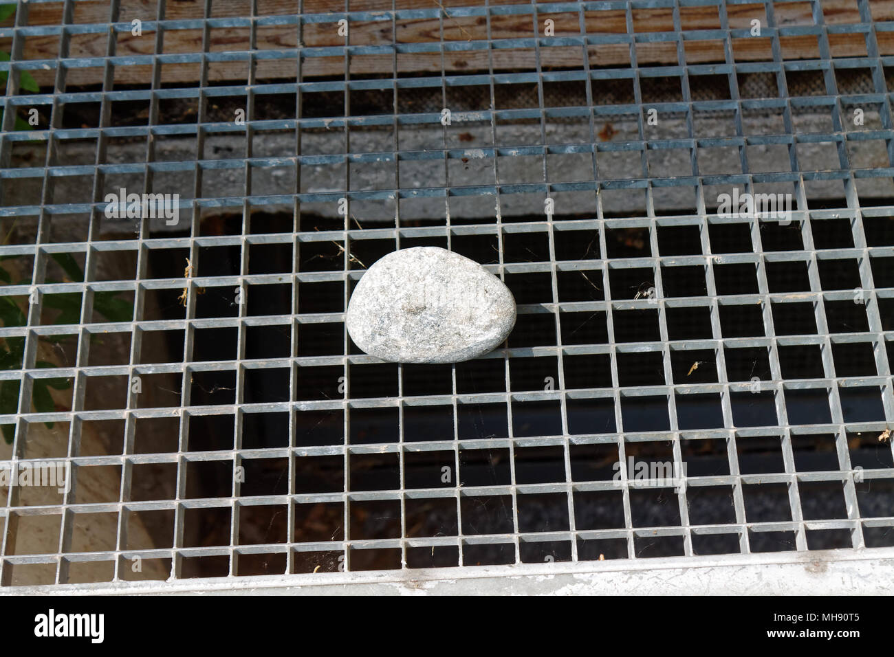Lonely stone on grid backdrop, abstract art Stock Photo - Alamy