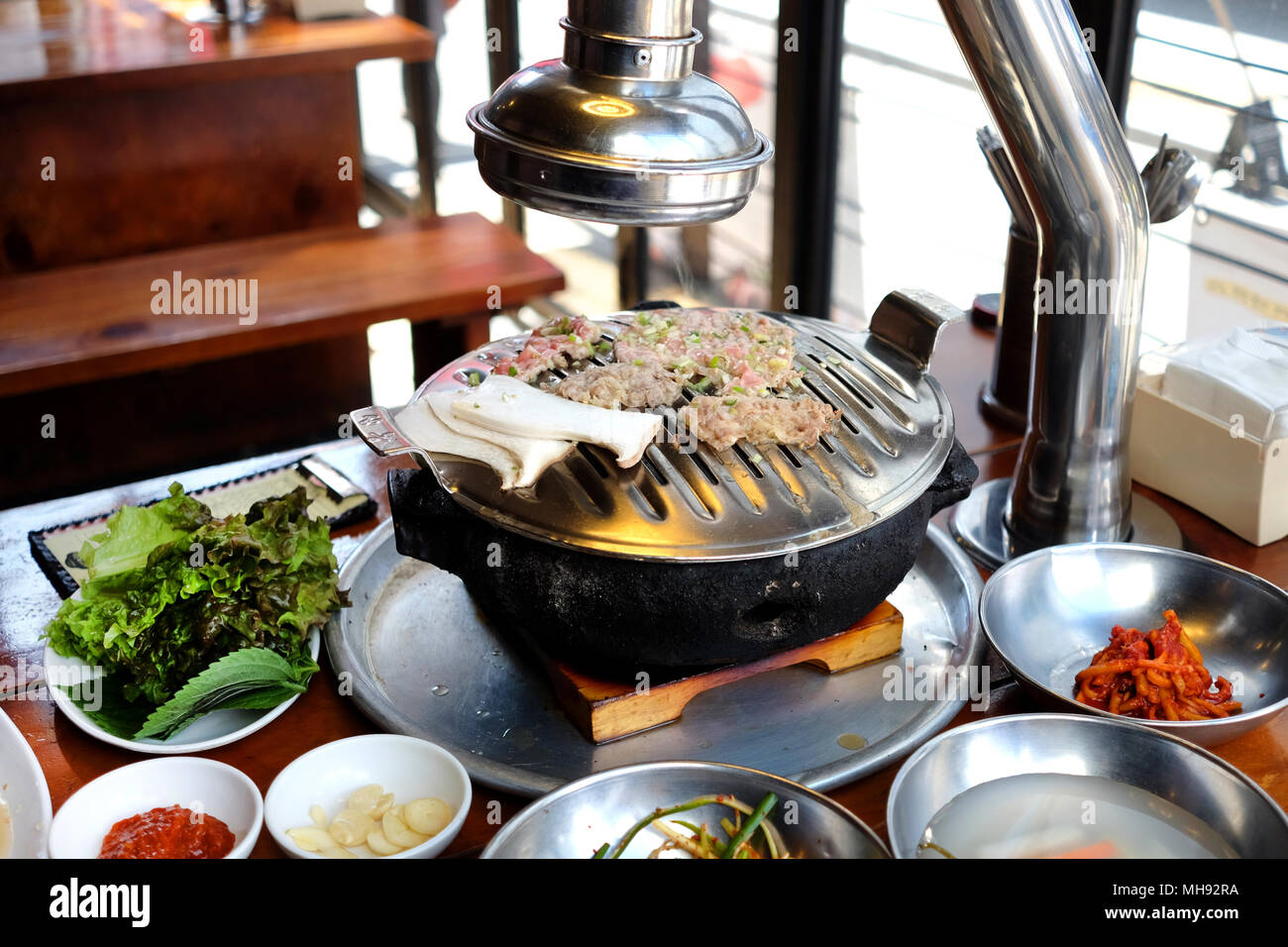 Korean traditional cuisine: meat with vegetables on fire roaster Stock ...