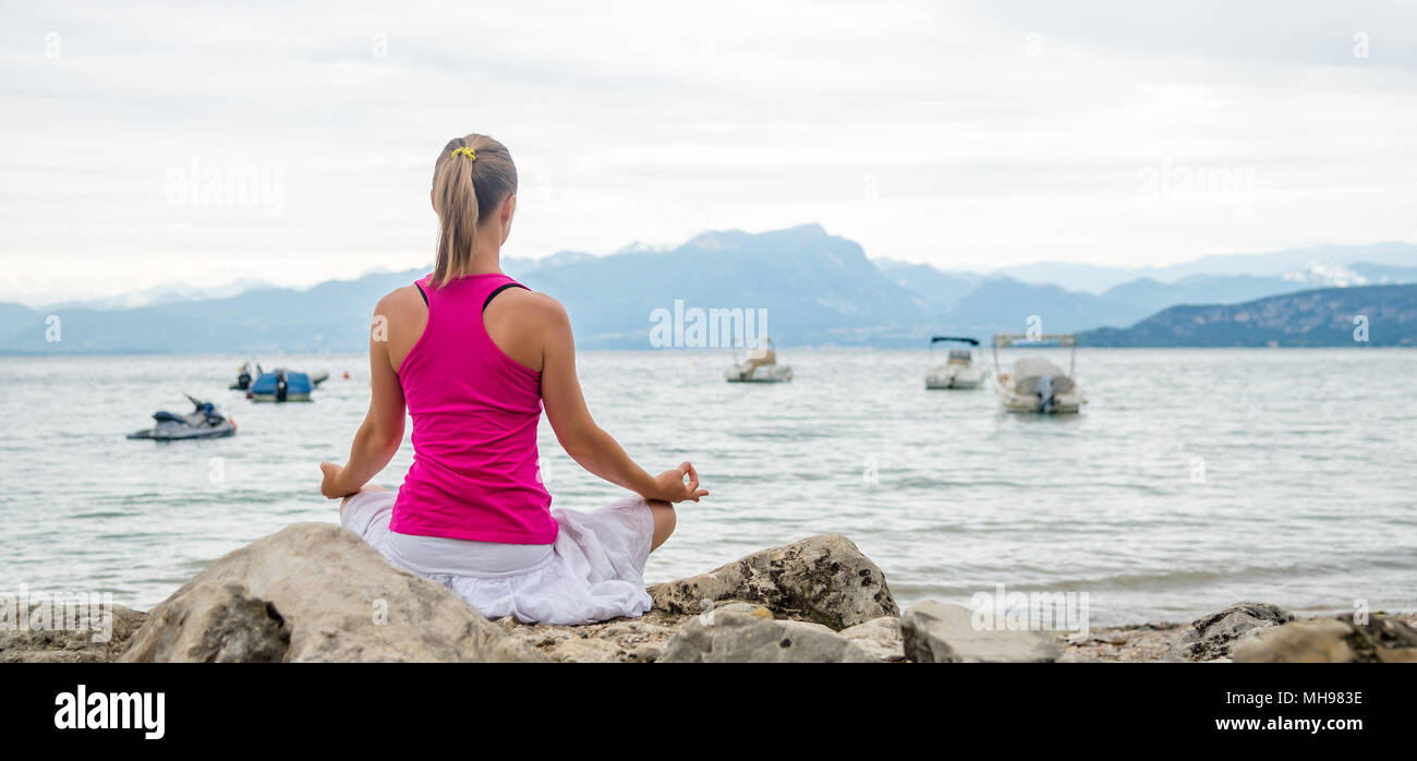 serenity and yoga practicing at the lake Garda. Italy Stock Photo - Alamy