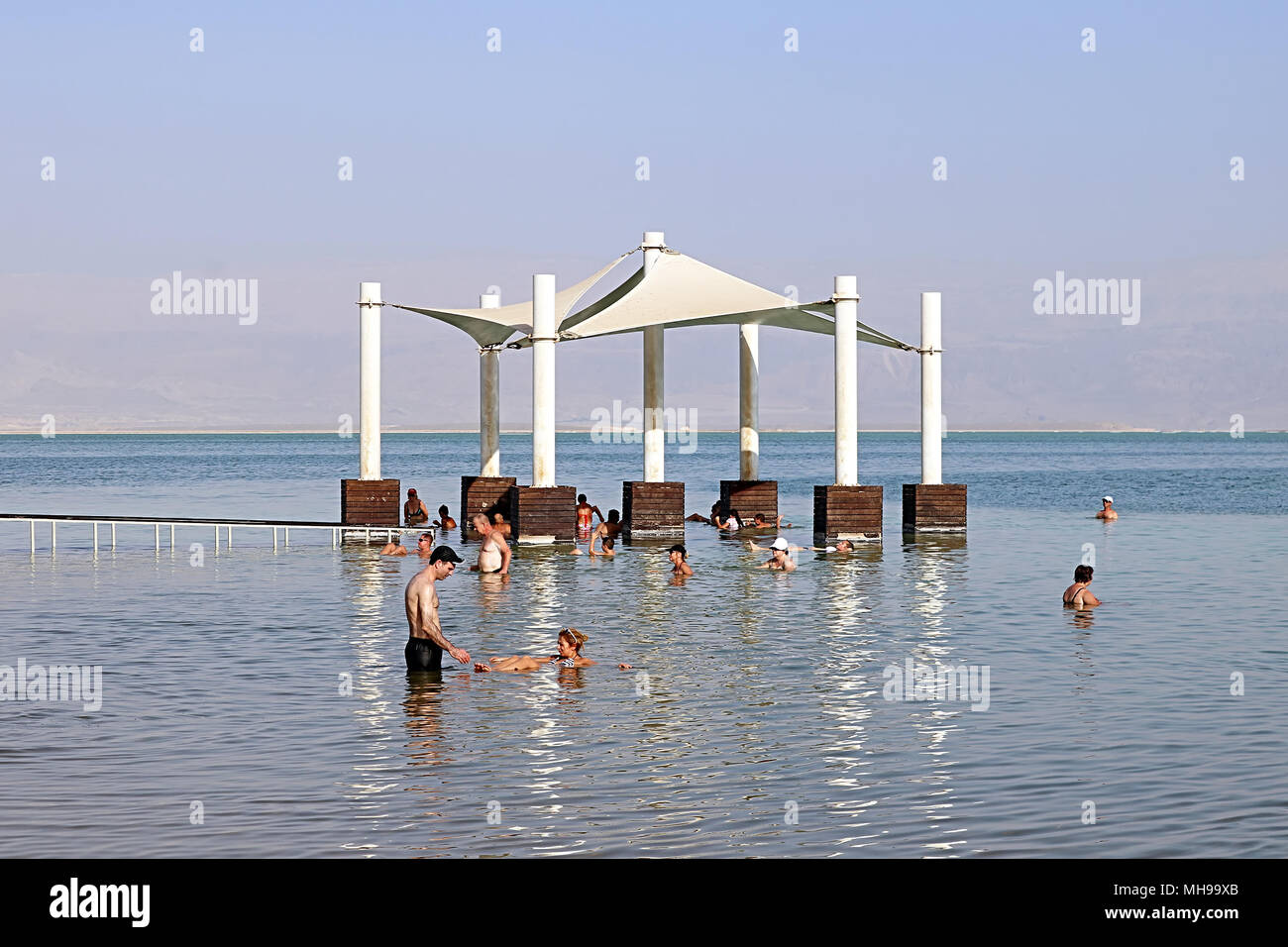 EIN BOKEK, ISRAEL - SEPTEMBER 22, 2017: Vacationers and tourists bathe in the Dead Sea in Ein ...