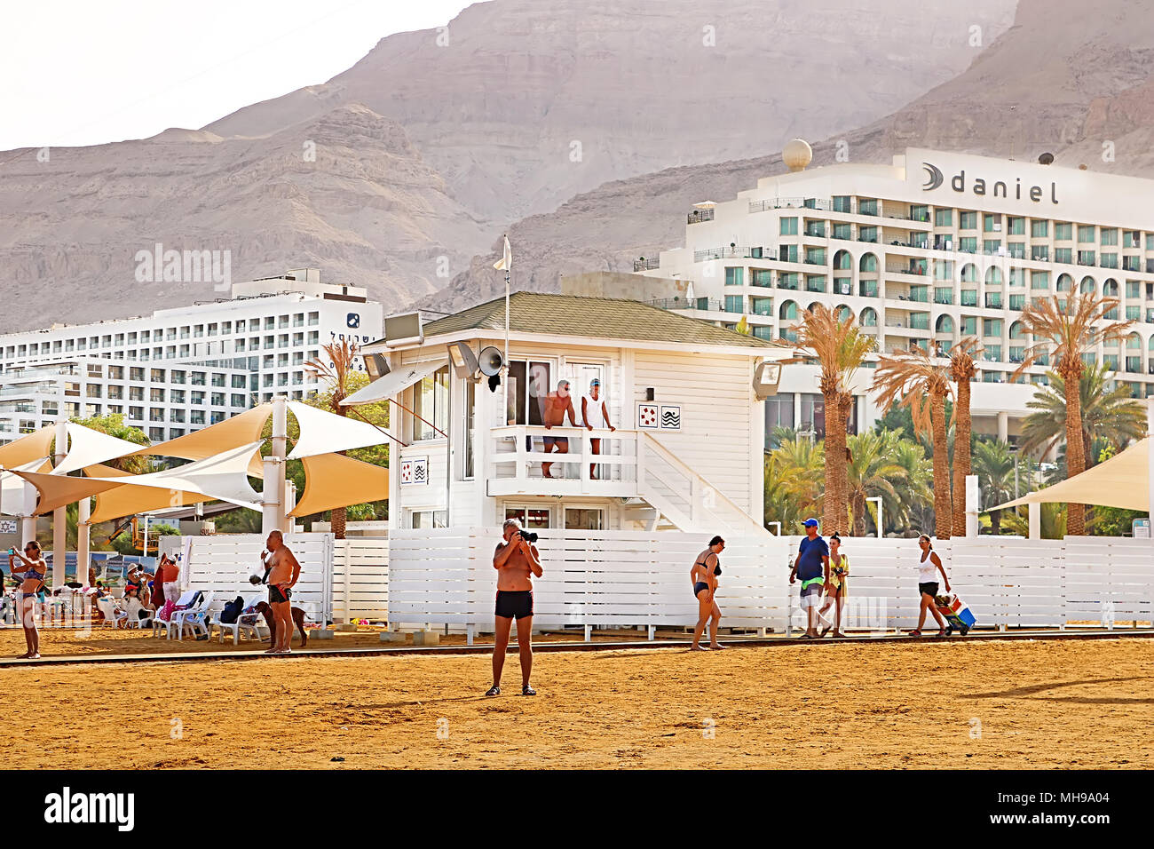 EIN BOKEK, ISRAEL - SEPTEMBER 22, 2017: Vacationers and tourists rest on the Dead Sea resort on ...