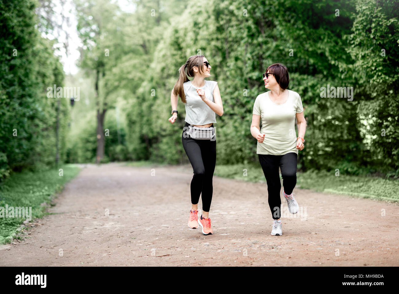 Older woman running hi-res stock photography and images - Alamy