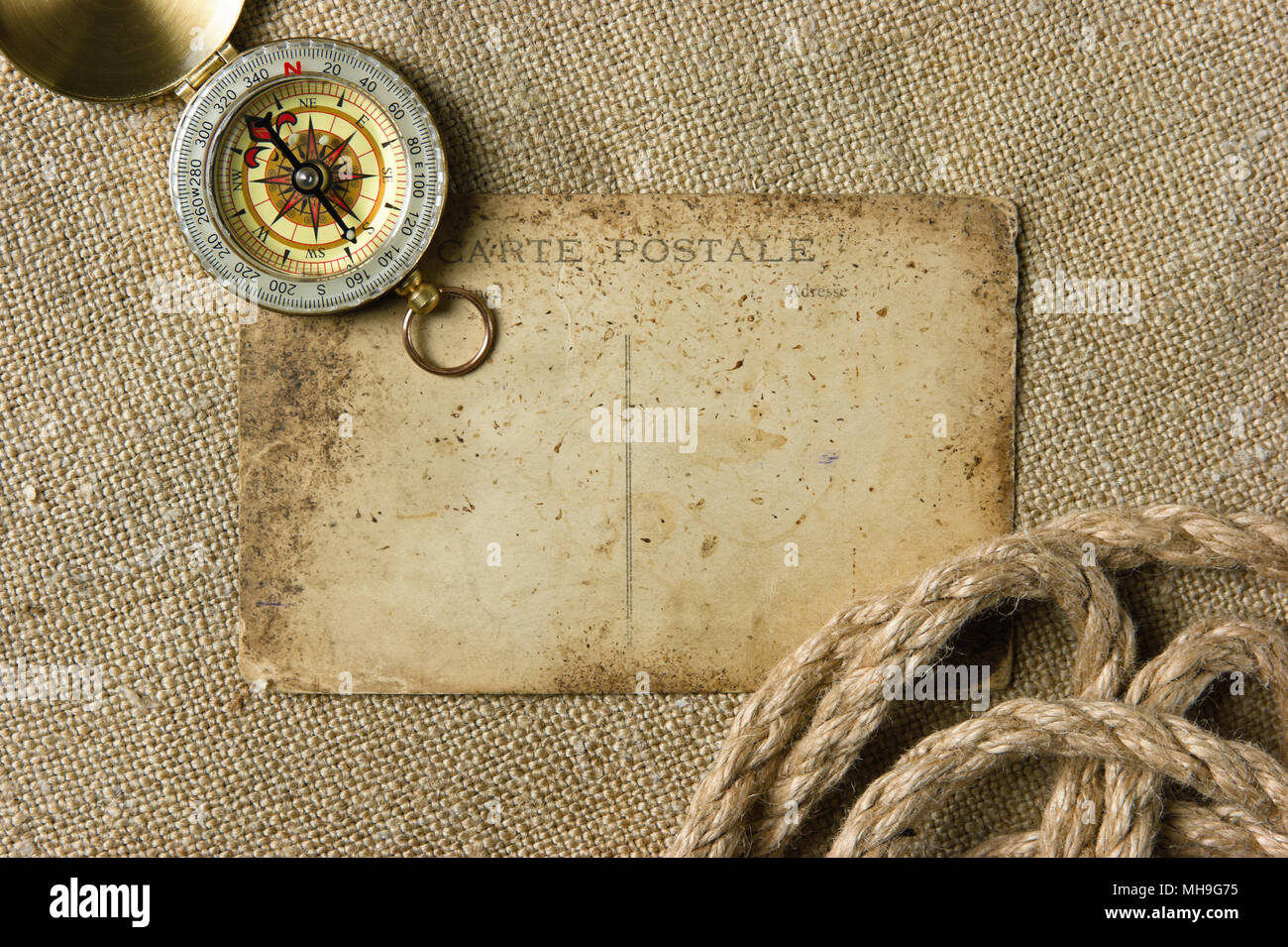 Vintage background with old paper and compass Stock Photo - Alamy