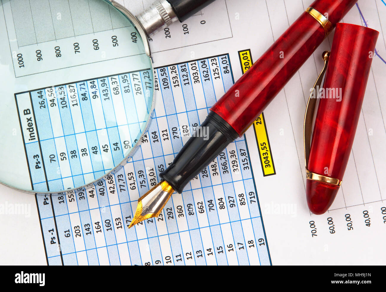 pen, magnifying glass and the working paper with a diagram Stock Photo ...