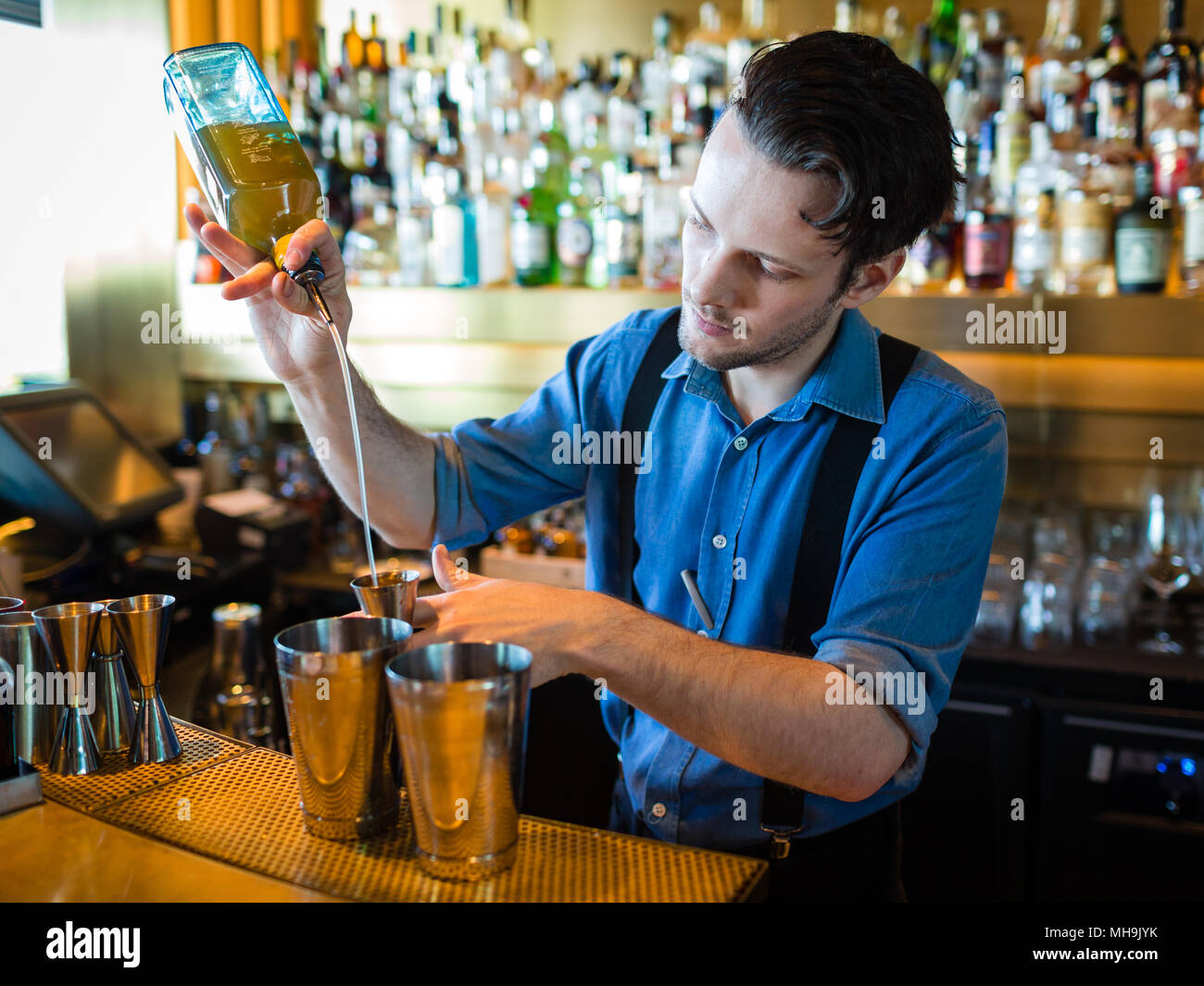 Bartender making a cocktail Stock Photo - Alamy
