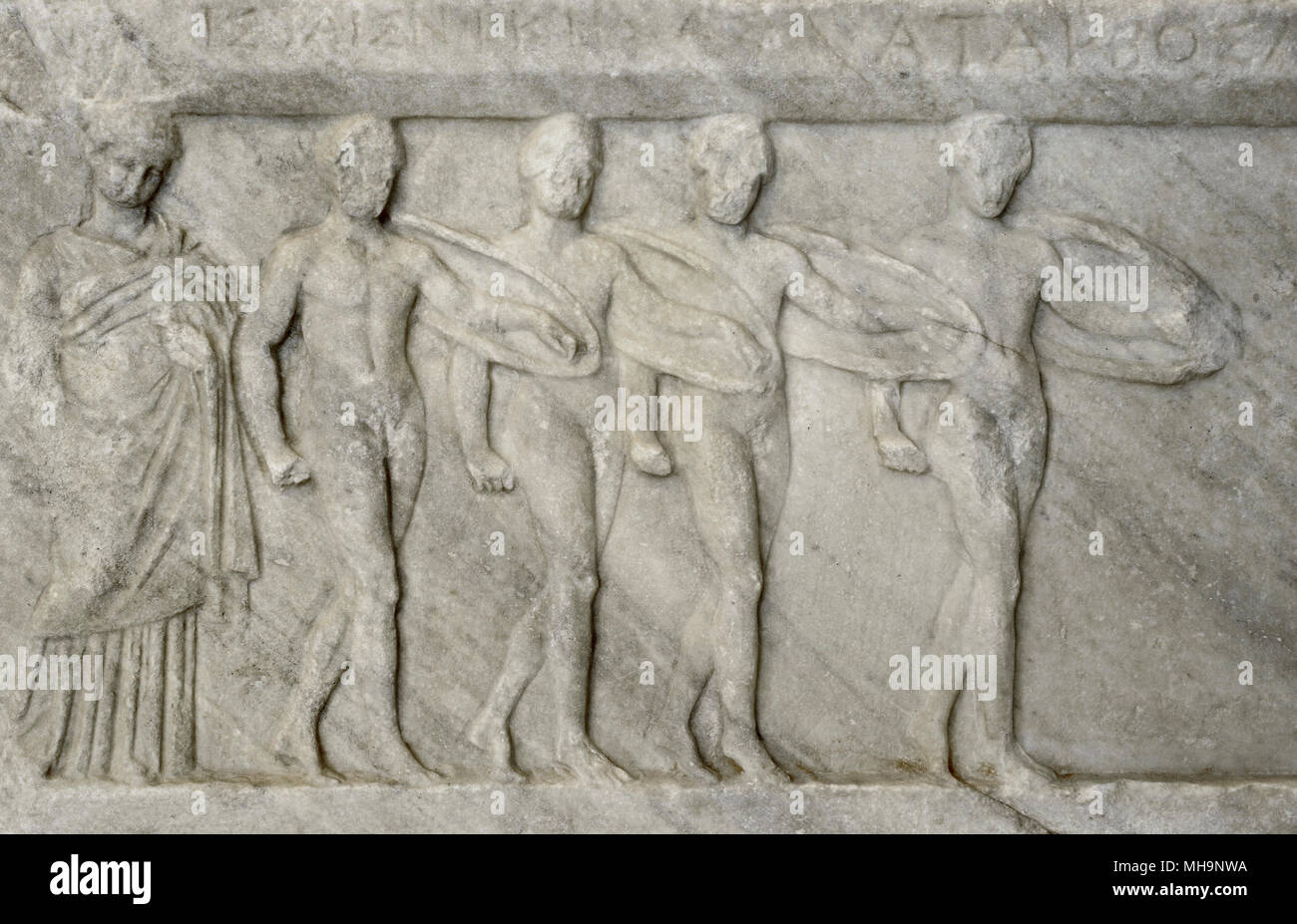 Base of a dedication, detail. The base supported three bronze statues ...