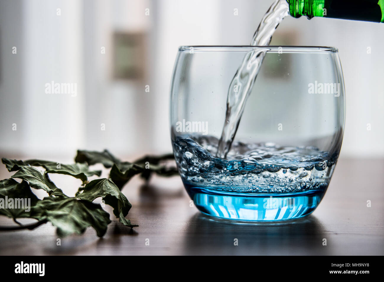 Pouring Mineral Water into the Glass Stock Photo - Alamy