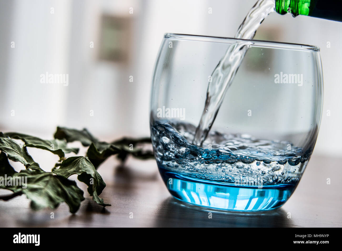 Pouring Mineral Water into the Glass Stock Photo - Alamy