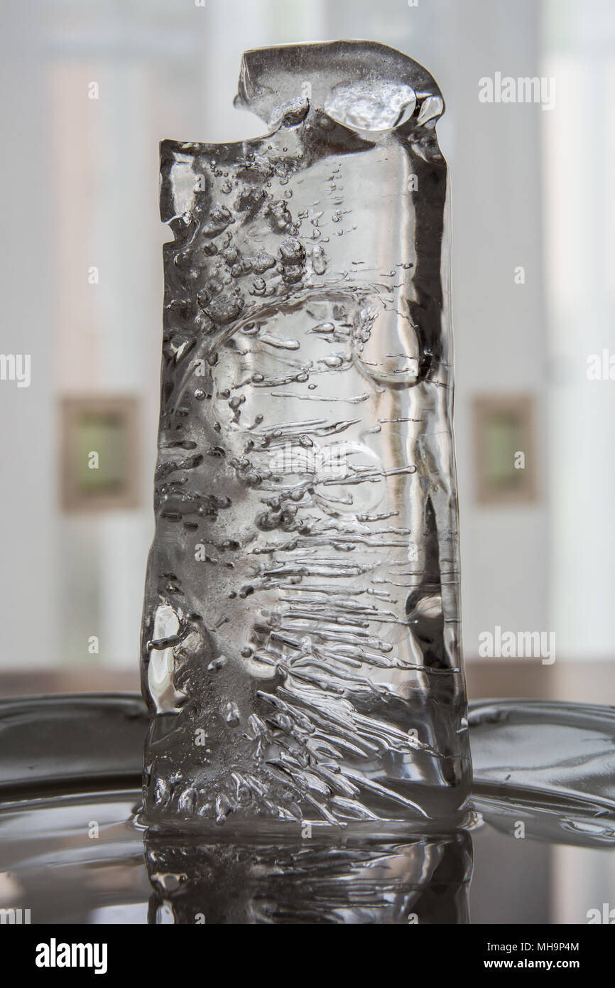 ice cube in a plate Stock Photo - Alamy